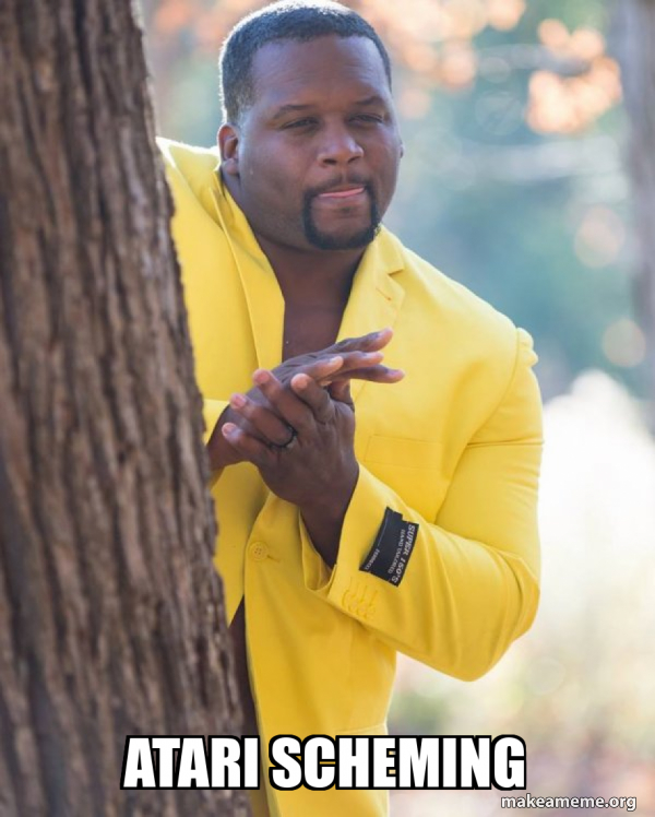 ATARI SCHEMING - Anthony Adams in Yellow Suit Rubbing Hands Meme Generator
