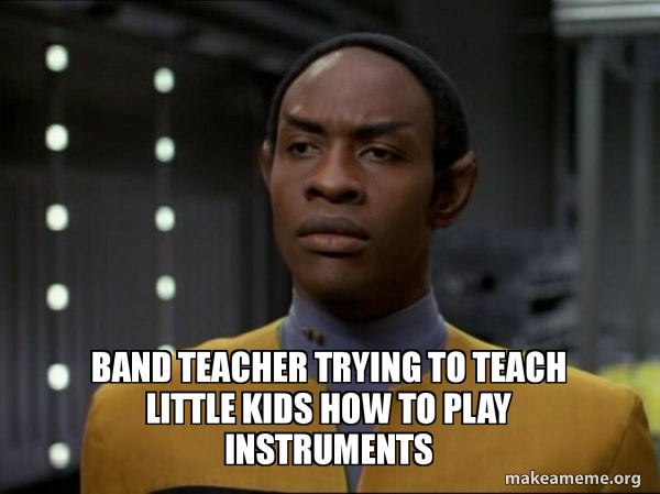 band teacher trying to teach little kids how to play instruments ...
