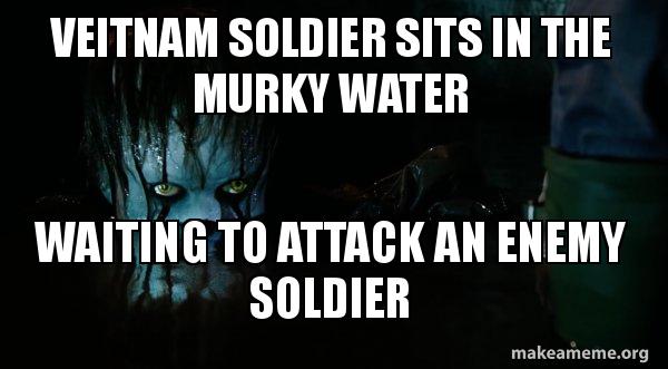 veitnam soldier sits in the murky water waiting to attack an enemy ...